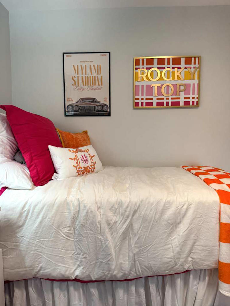 In this game-day glam dorm room, orange is the hero color