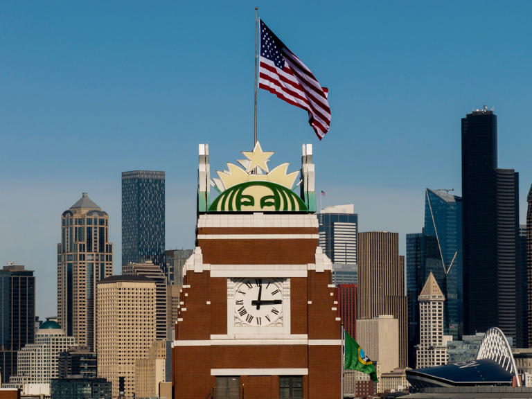 Starbucks says its turnaround is gaining momentum and cuts 300 more jobs