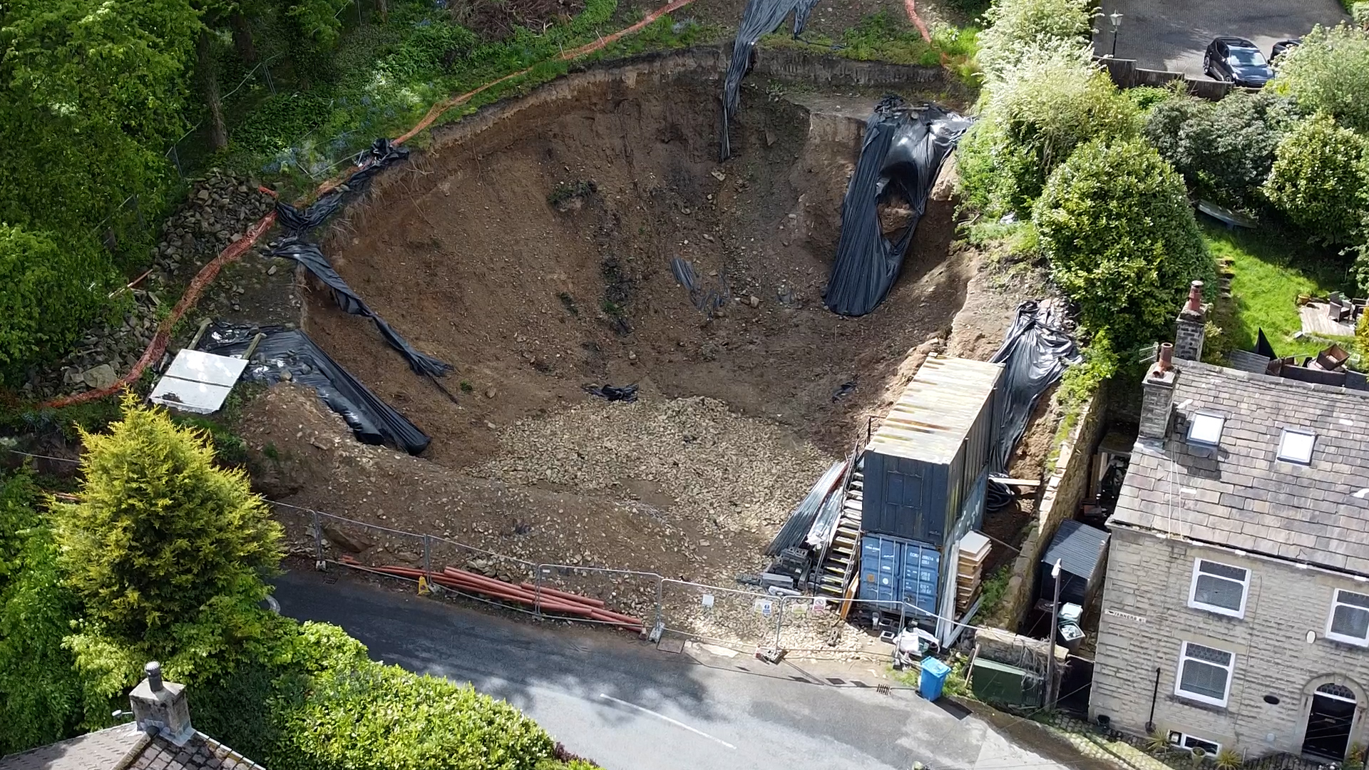 Mum fears huge landslide could engulf home after builders abandon 35ft ...