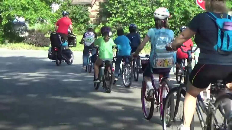 Randolph Elementary students roll into school with annual bike train