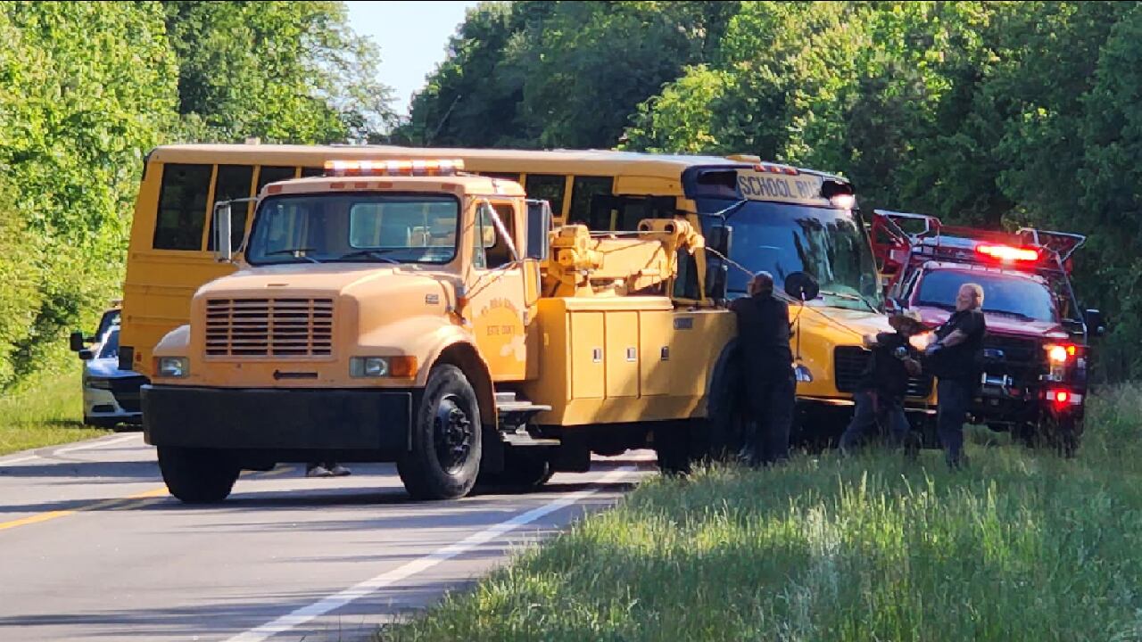 Pickup truck driver charged after school bus crash on Highway 11