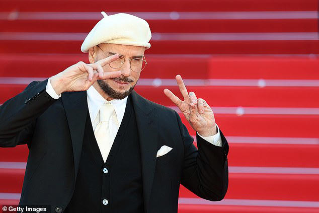 John Travolta, 72, roasted over Cannes red carpet look as he poses with ...