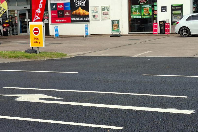 Botched road marking directs drivers wrong way into petrol station