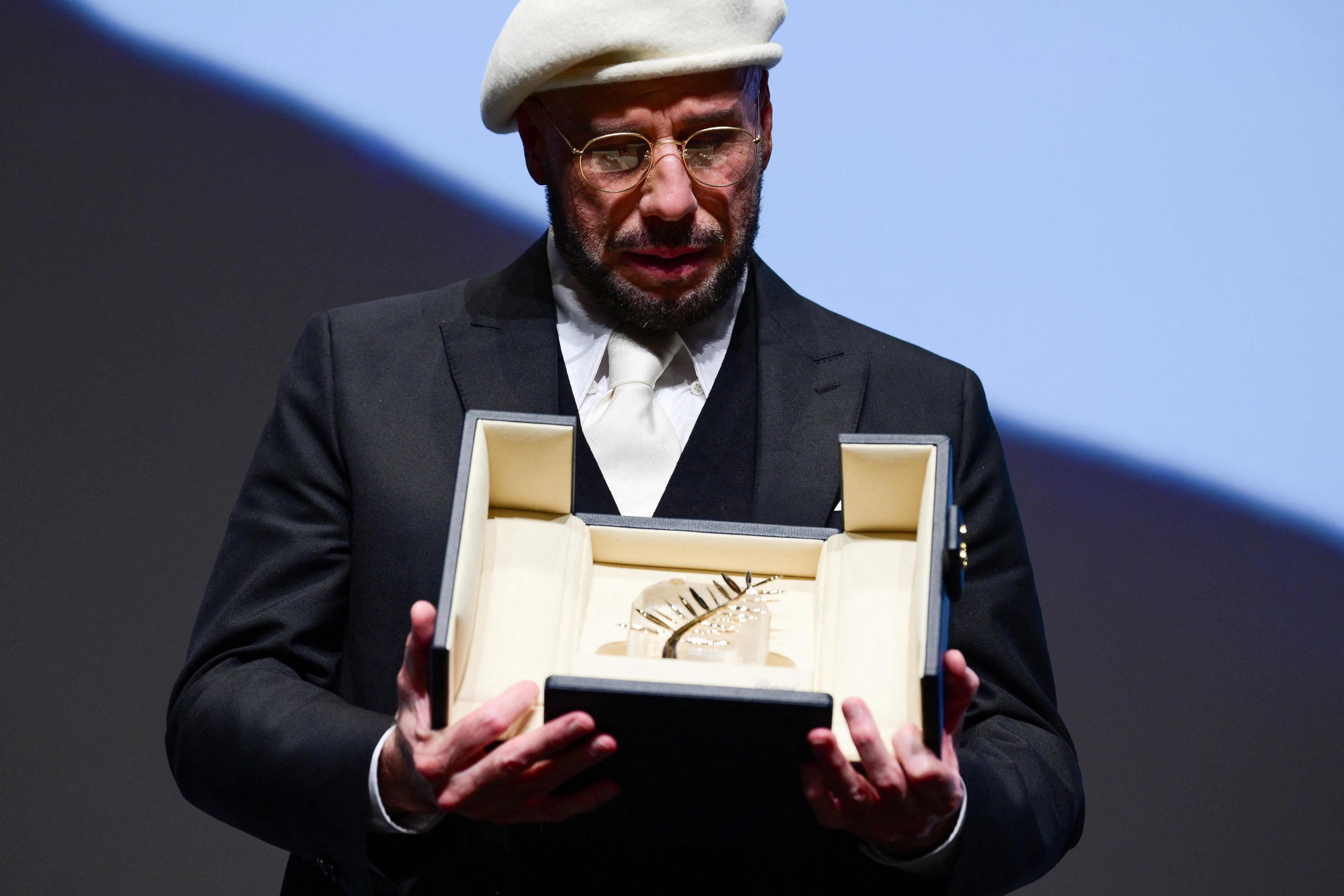 John Travolta cries after surprise award at Cannes Film Festival