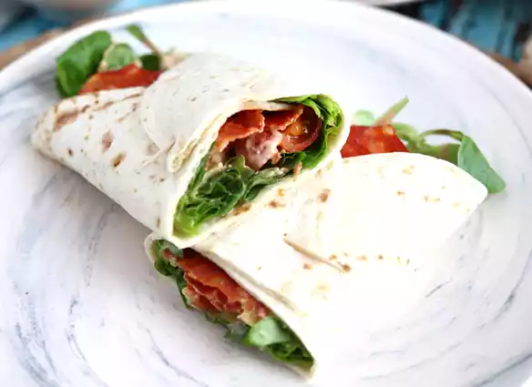 Chorizo, avocado, and tomato wrap sandwich