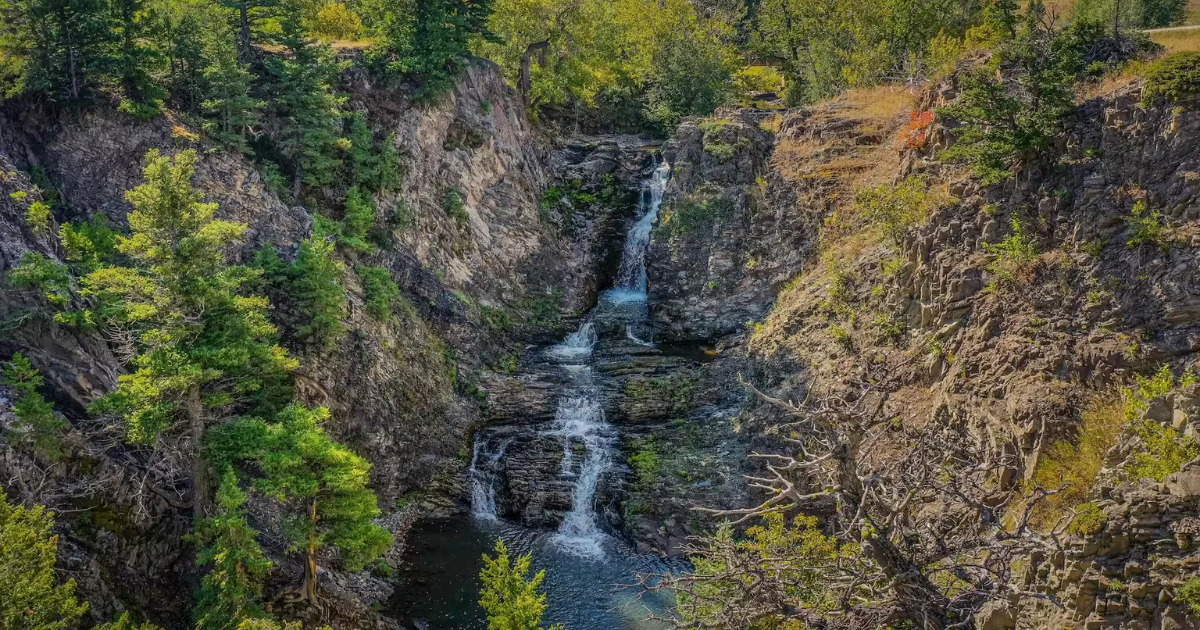 This dreamy Montana Airbnb has a 40-foot waterfall and swimming hole