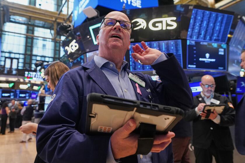 Stocks drop from records as worries about oil prices rattle the bond market