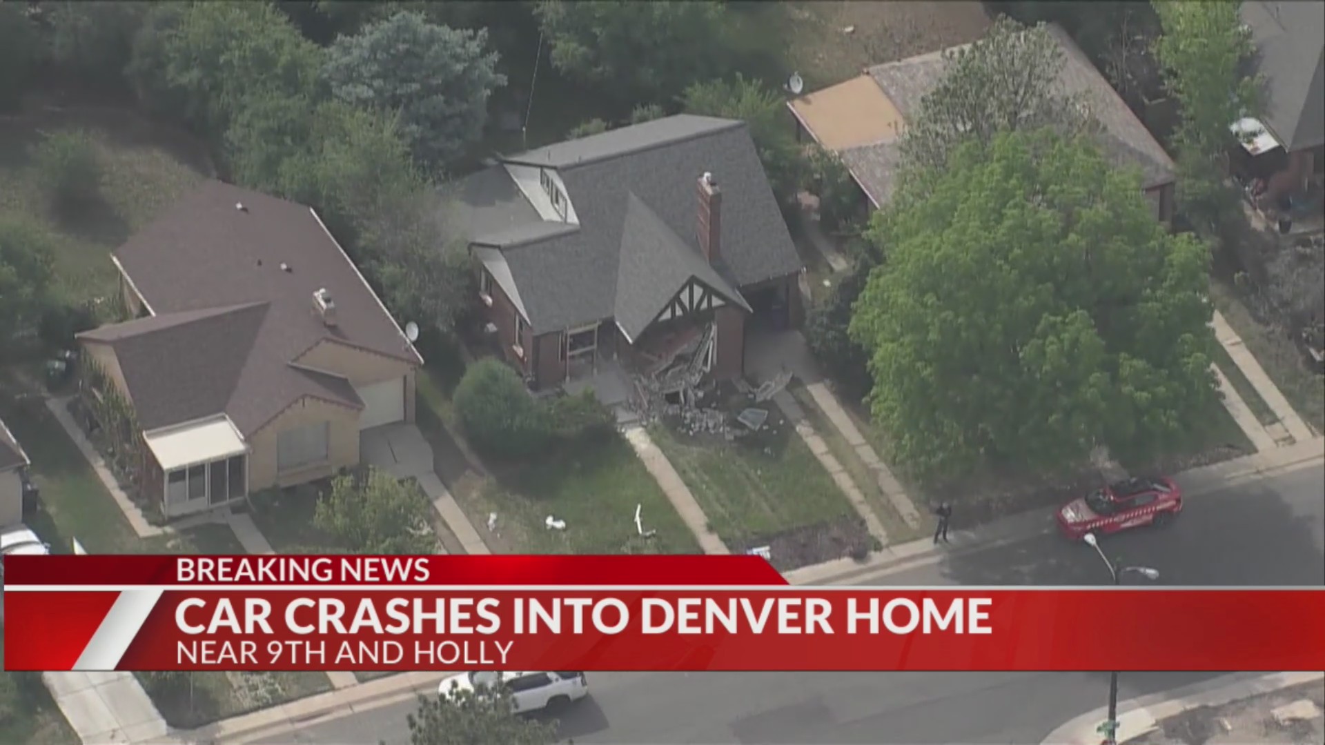 Car crashes into Denver home, catches fire; driver taken to hospital