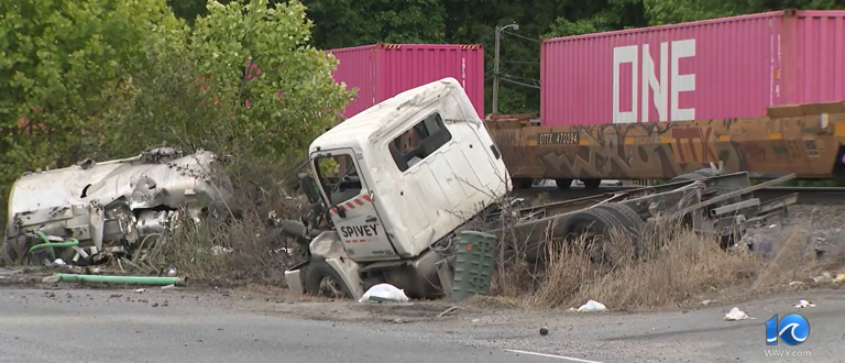 Septic truck explodes after being struck by train, video shows