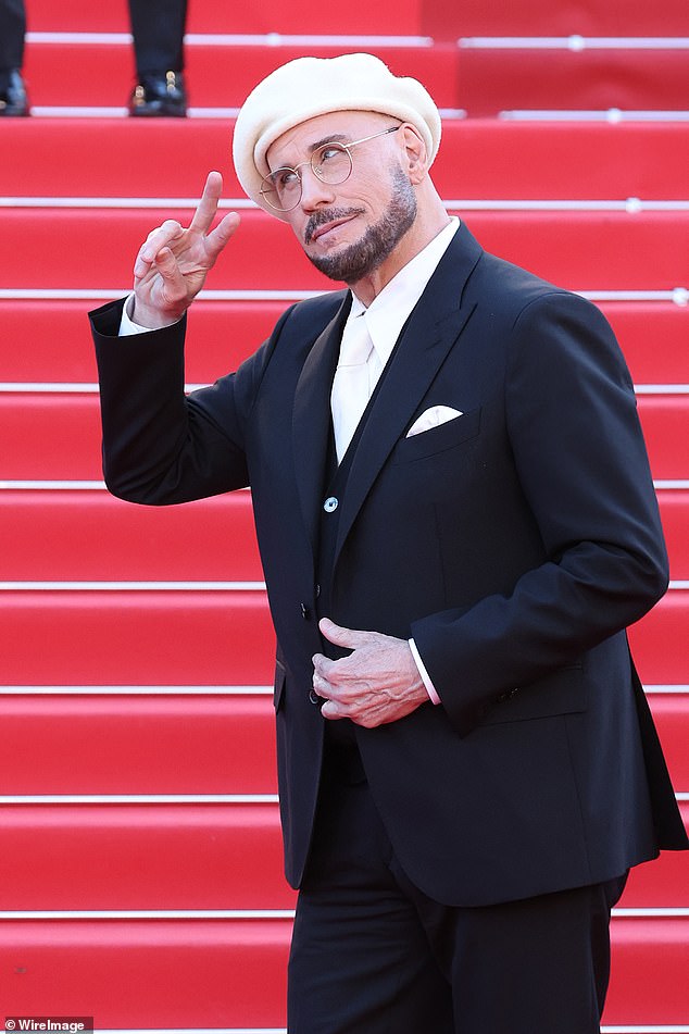 John Travolta, 72, roasted over Cannes red carpet look as he poses with ...