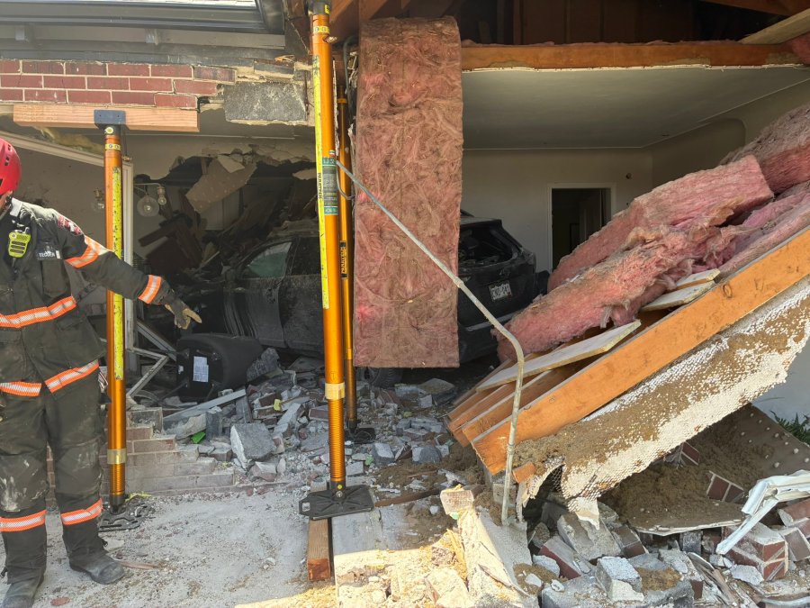 Car crashes into Denver home, catches fire; driver taken to hospital