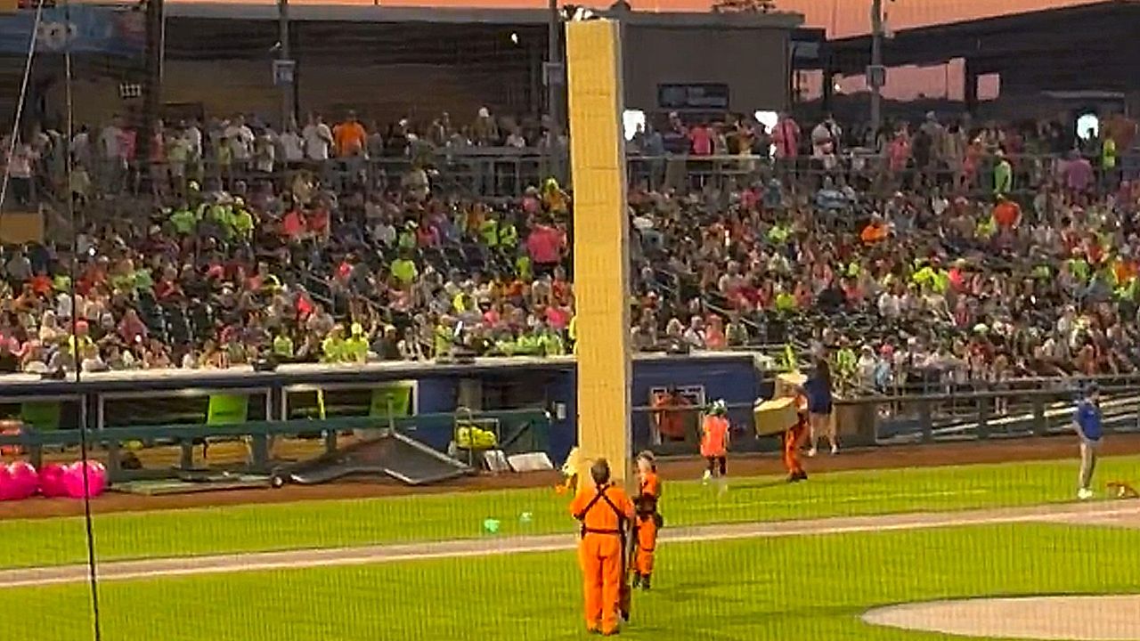Performers entertain stadium crowd with box-stacking challenge