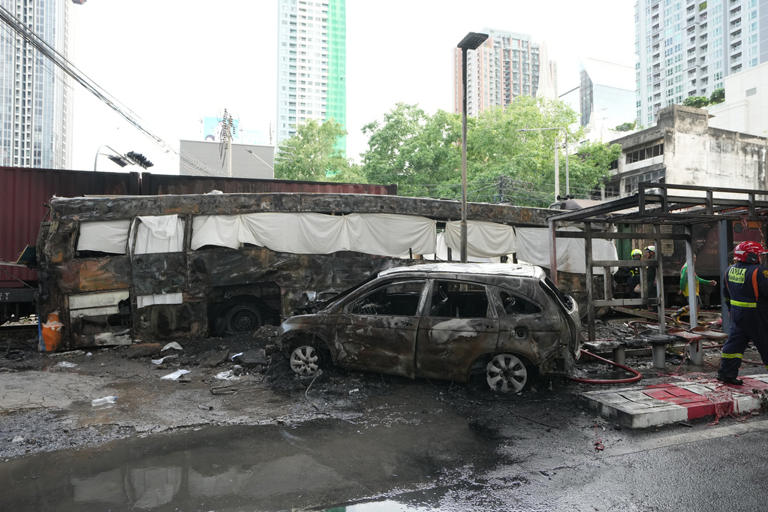 A cargo train hits a public bus at a Bangkok rail crossing, killing at ...