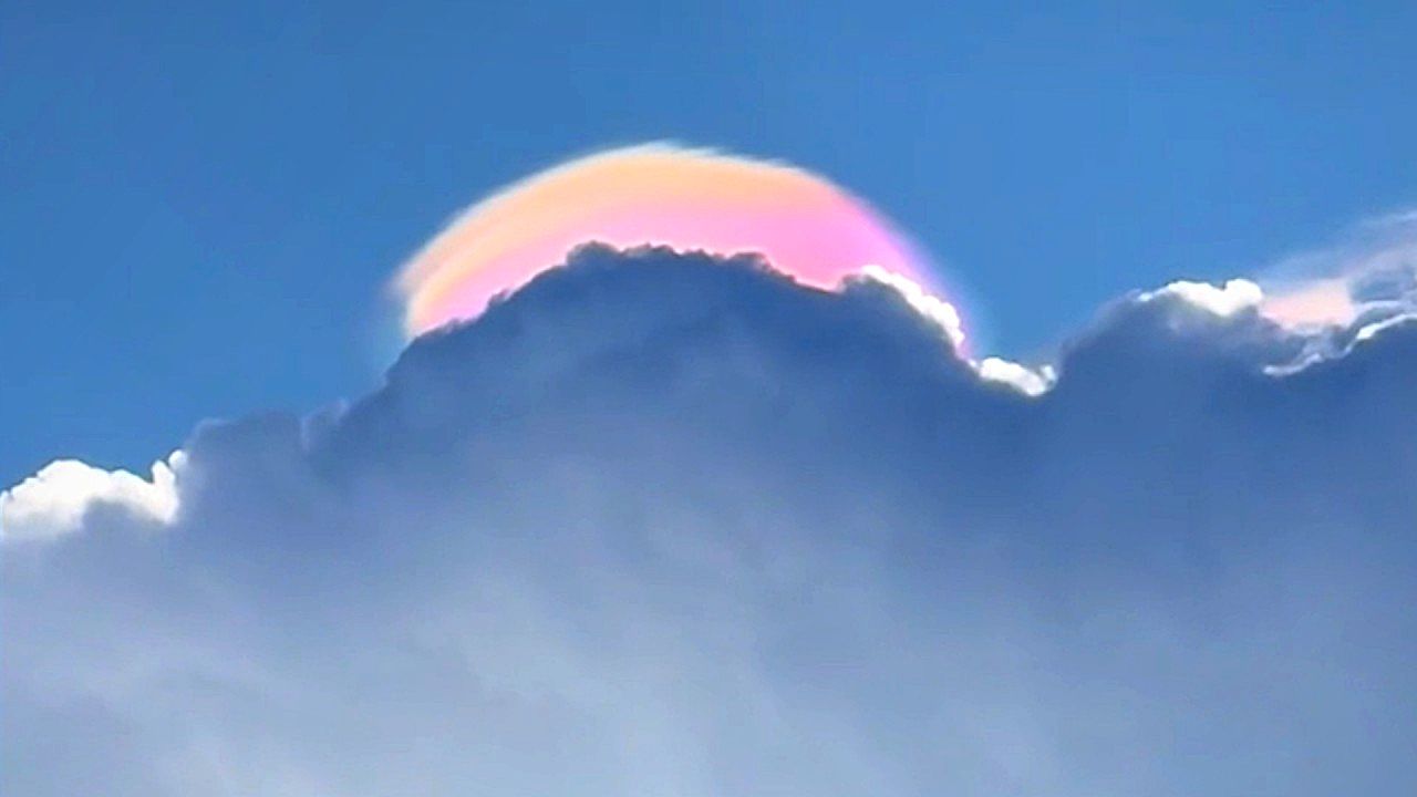A celestial spectacle! A rare rainbow cloud lights up the sky over the ...