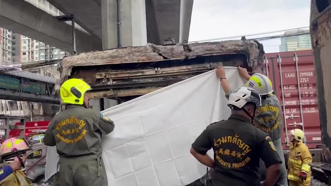 Eight killed when train crashes into bus on level cross in Bangkok