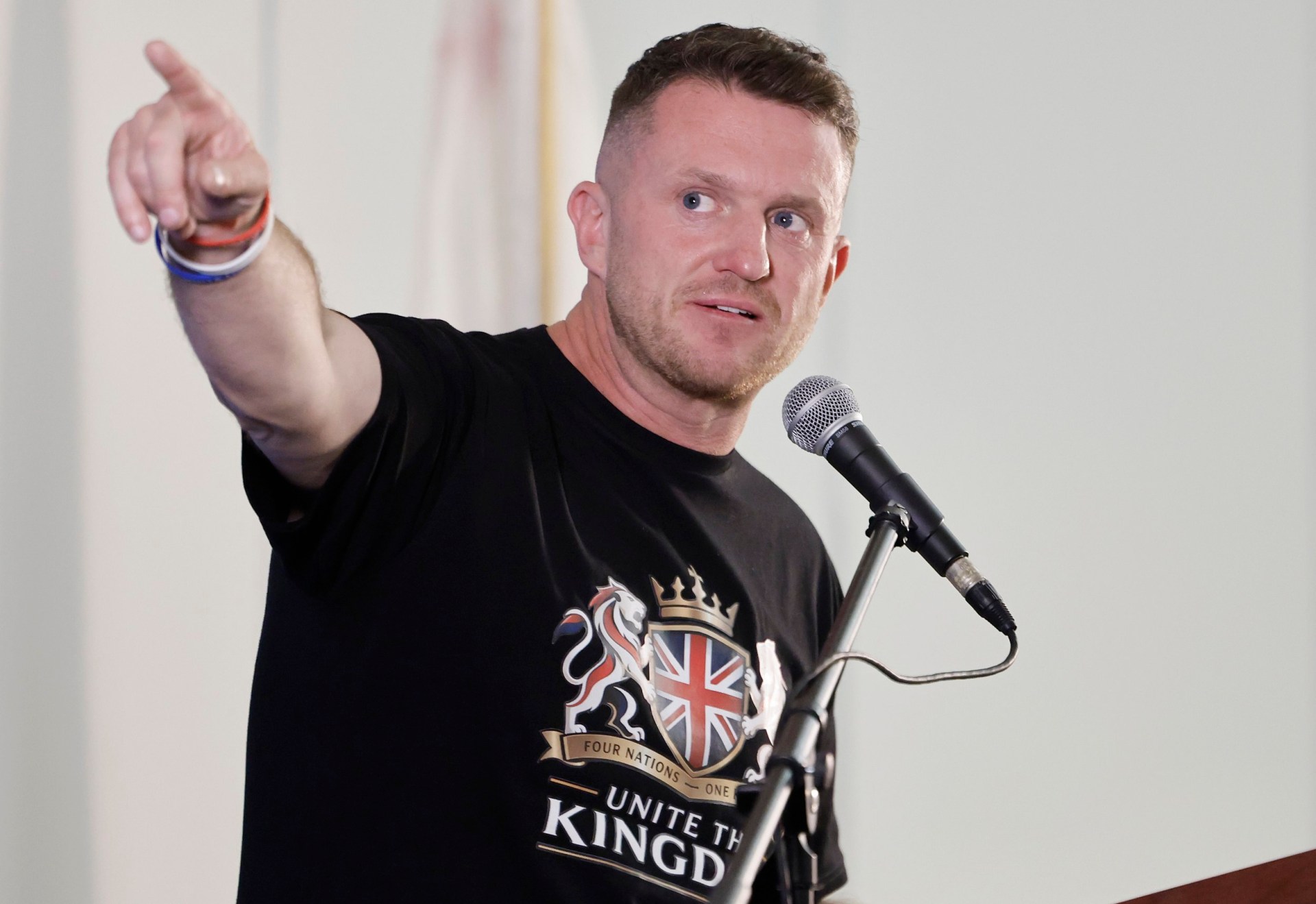 Violence condemned after Tommy Robinson stokes up disorder in Belfast