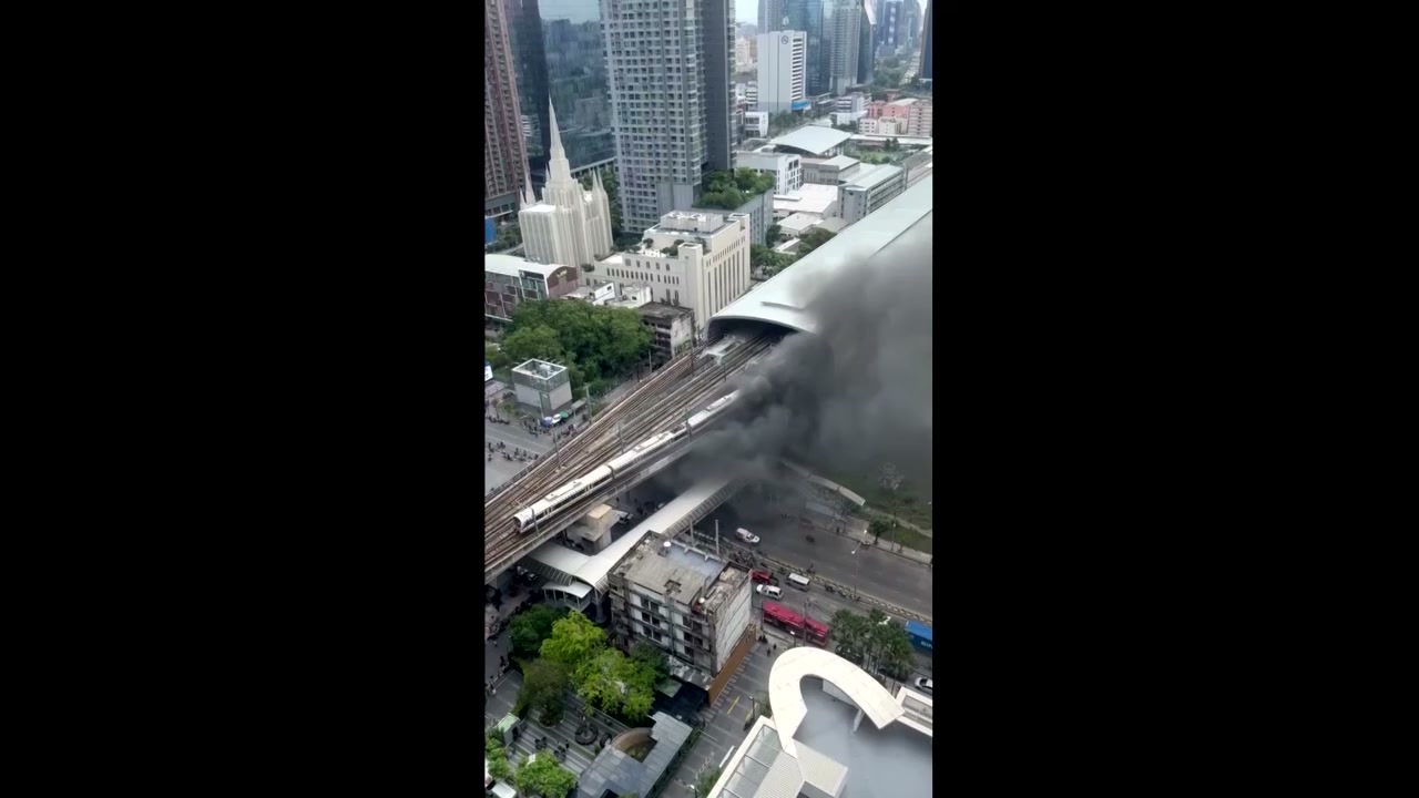 Eyewitness video shows smoke rising after deadly train collision in Bangkok