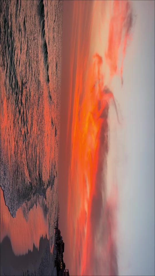 October beach sunset paints the sky in vivid orange