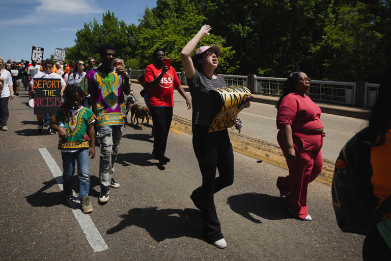 Voting rights activists take symbolic walk across famous bridge as ...