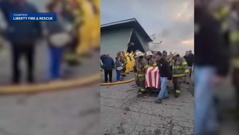 A somber moment: Watch as a firefighter's body is removed from the fire ...