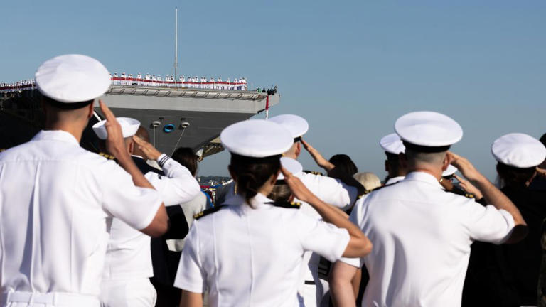 US aircraft carrier returns home after record deployment that included ...