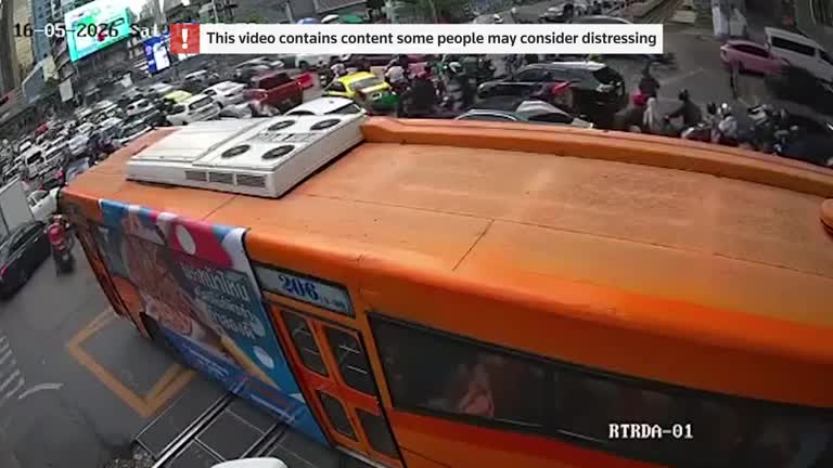 CCTV shows moment freight train collides with bus in Thailand