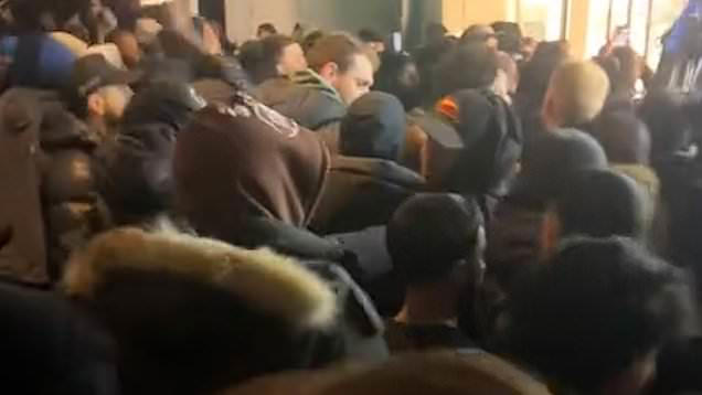 Crowds queue all night for Swatch launch only to see mob swarm in and ...