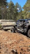 Utility vehicle overturns while attempting obstacle course challenge