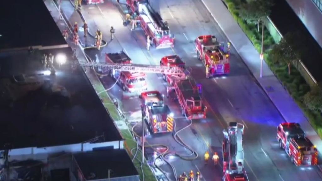 Los Angeles firefighters battle second alarm blaze at Van Nuys ...