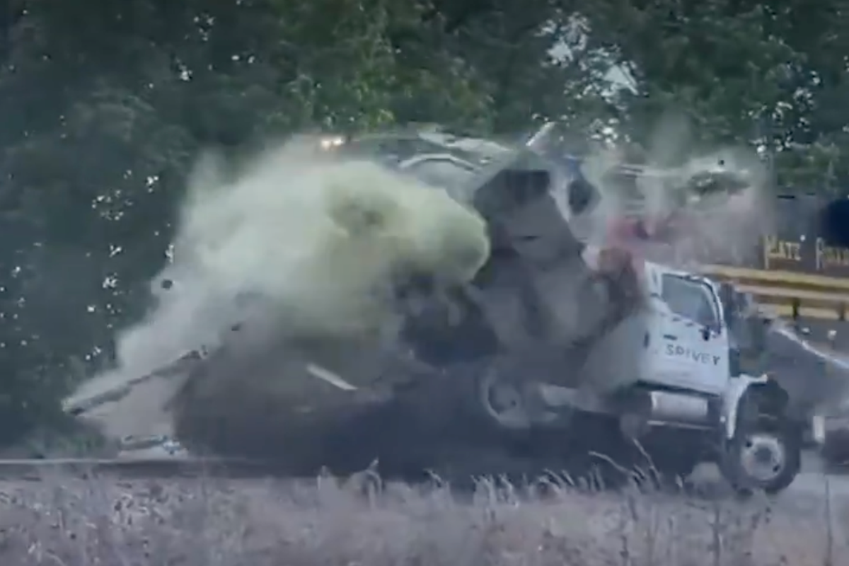 Sewage tank explodes after US freight train smashes into truck