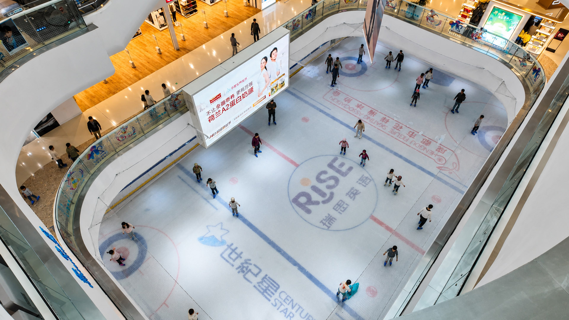A full size ice skating area sits beneath this Chinese mall atrium