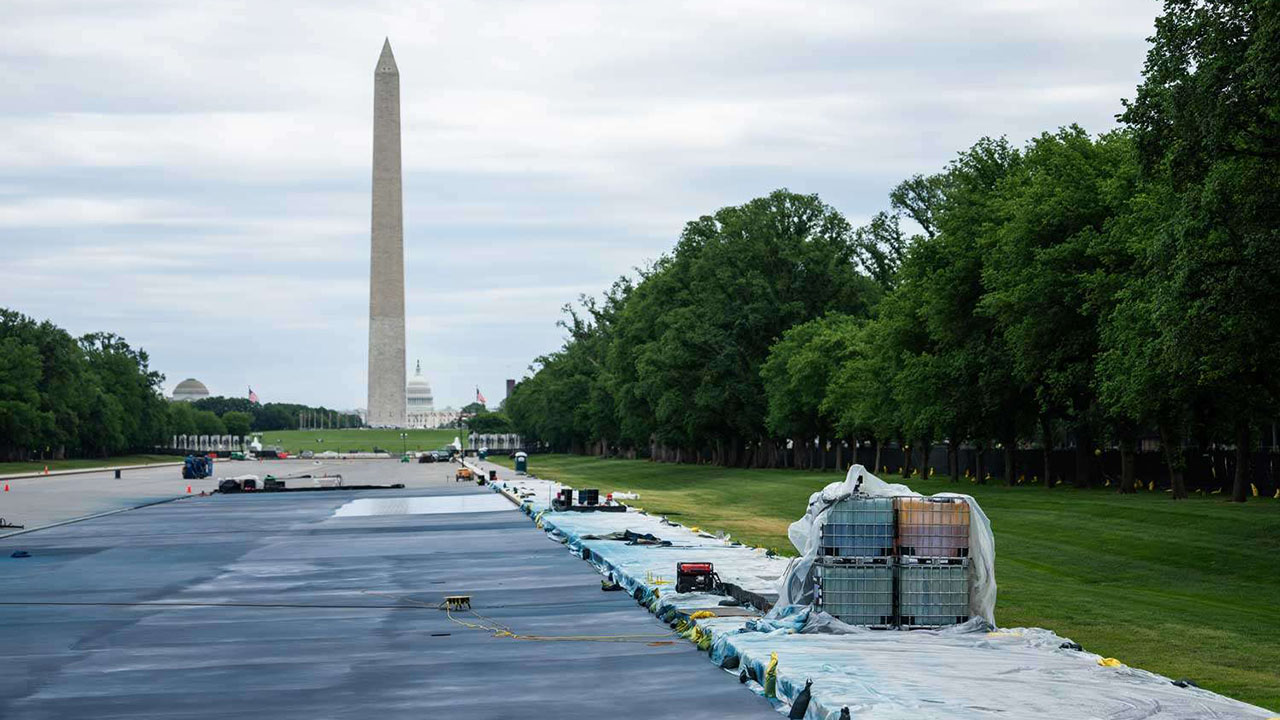Disturbing sight behind black fence hiding National Mall's reflecting pool