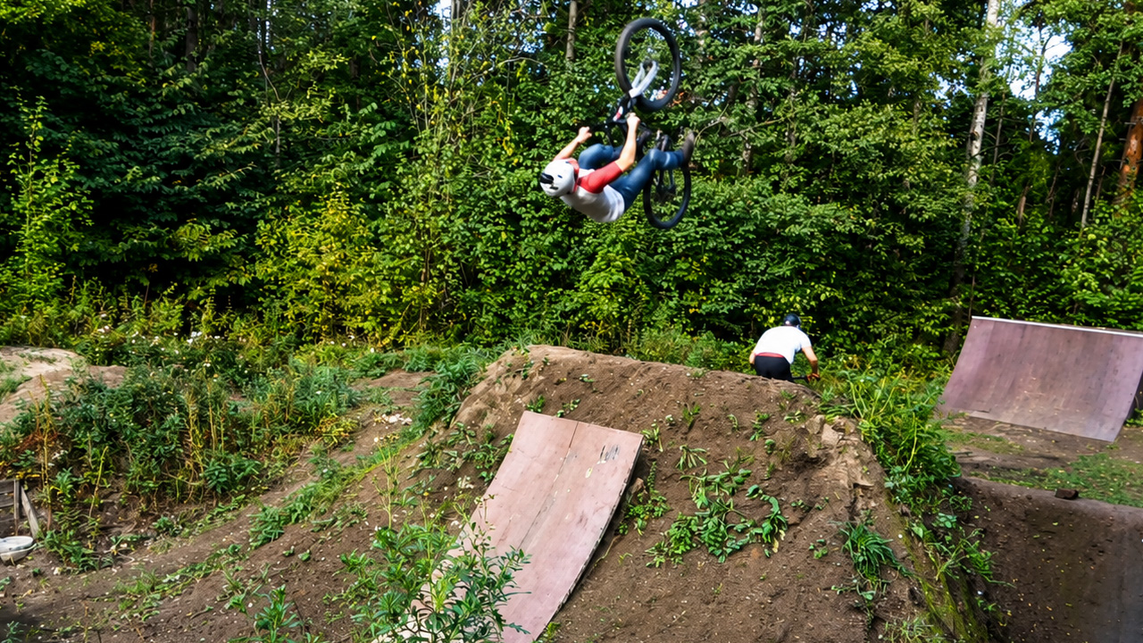 Extreme mountain bike tricks on hidden mini ramps