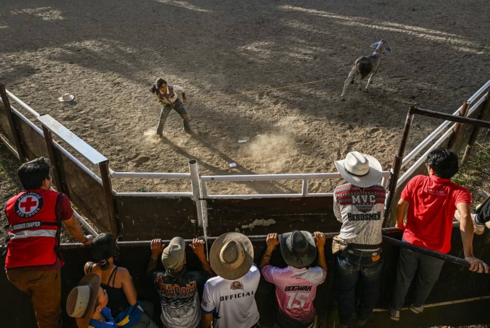 Cowgirls of Philippine rodeo tackle steers, stereotypes