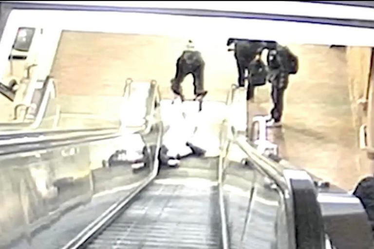 Moment man gets skin ripped off in escalator as people walk by without ...
