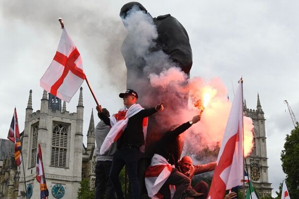 Outrage as vandals mount Churchill statue during London protests as ...