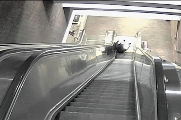 Moment man gets skin ripped off in escalator as people walk by without ...