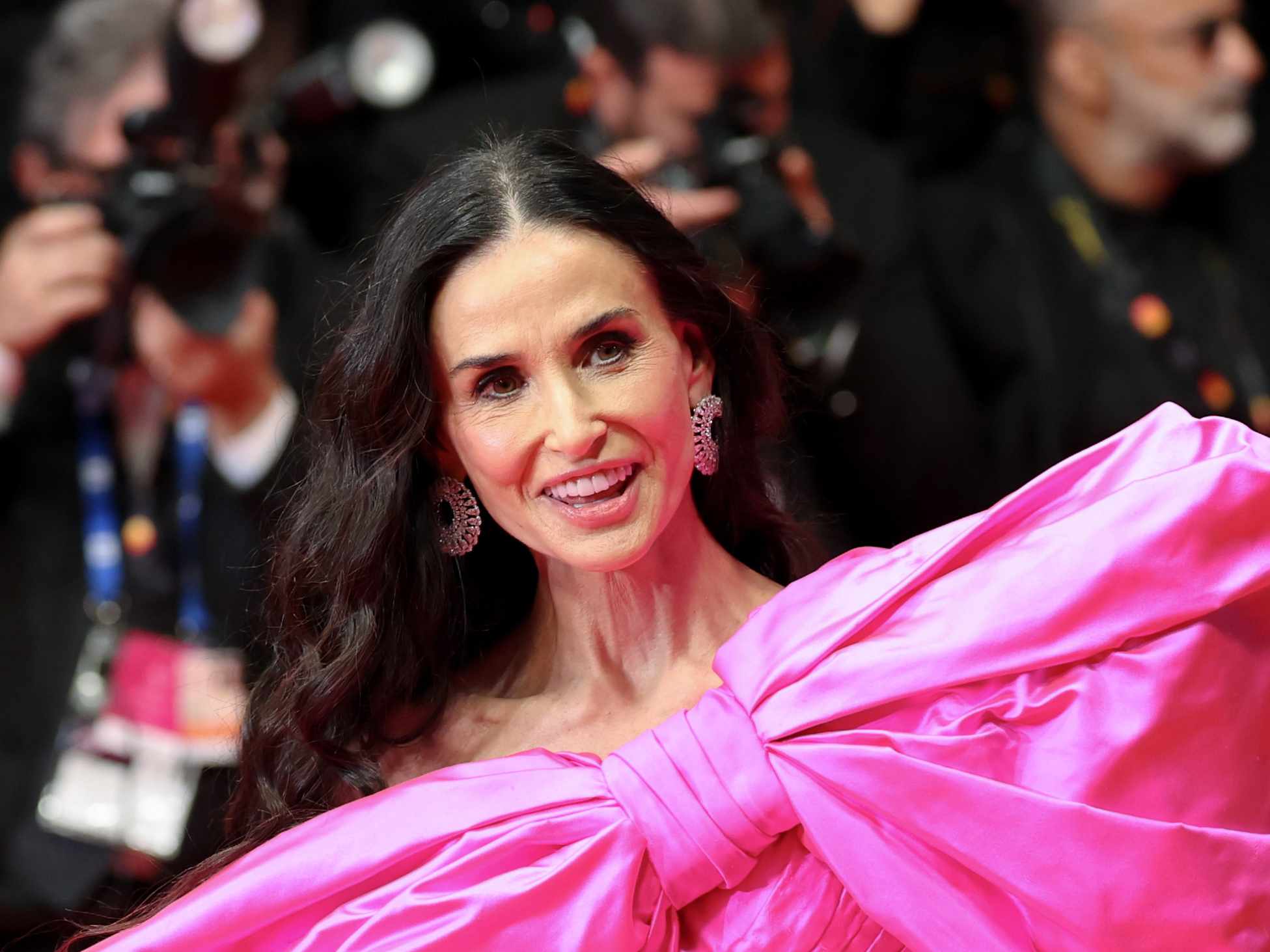 Demi Moore's tattered hot pink ballgown comes with a truly giant OTT bow