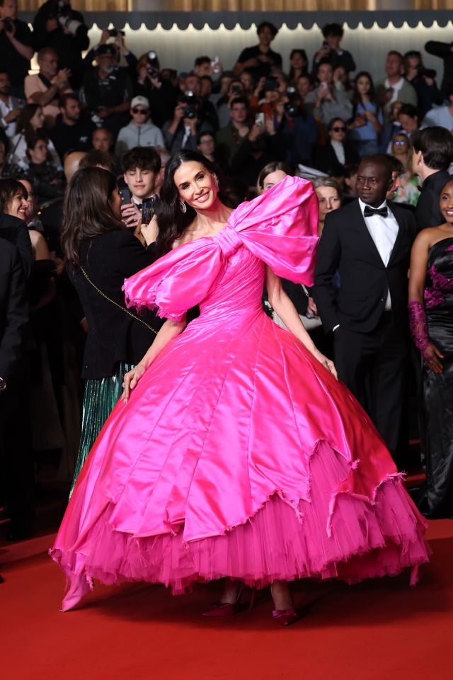 Demi Moore's tattered hot pink ballgown comes with a truly giant OTT bow