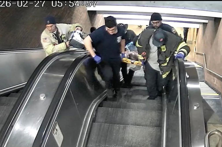 Moment man gets skin ripped off in escalator as people walk by without ...