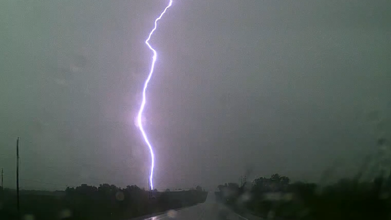 Lightning strikes flash dangerously close on Iowa roadway