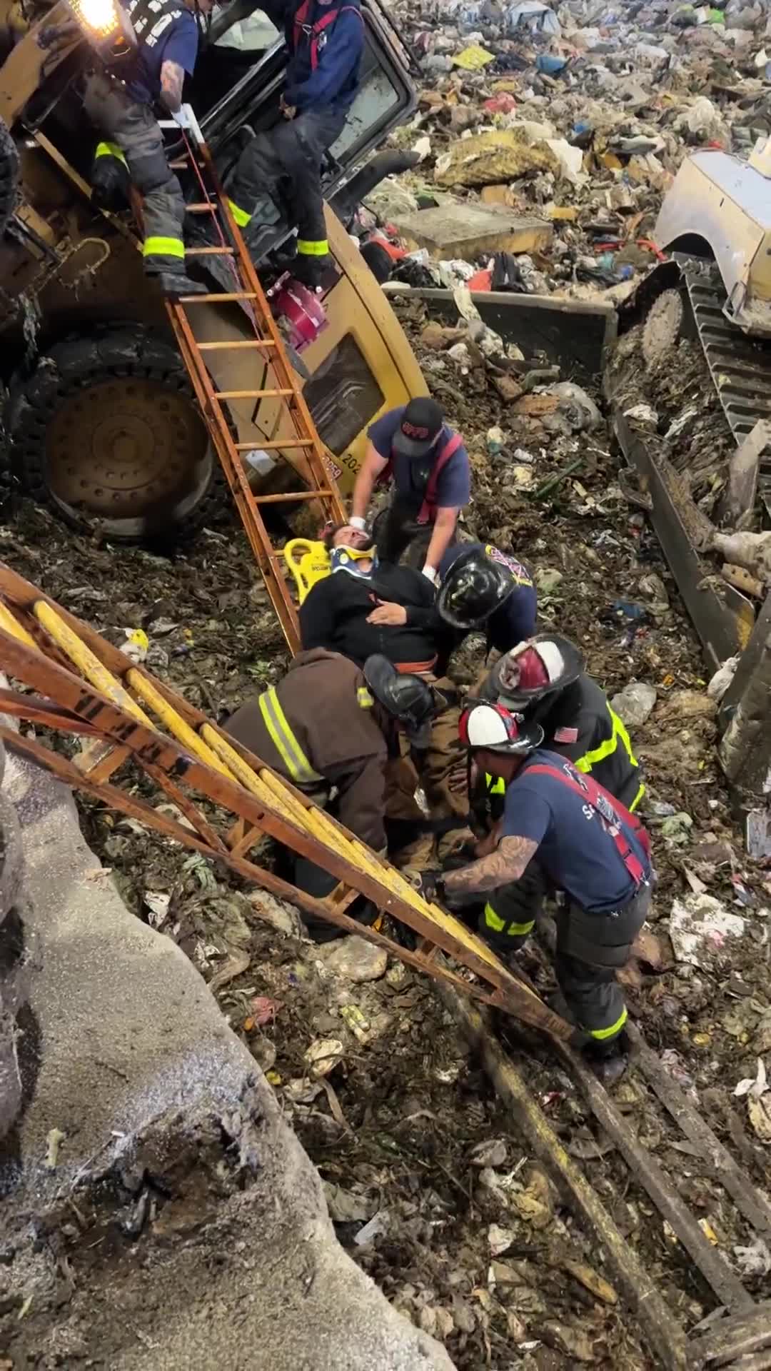Worker crashes into recycling pit, successfully rescued