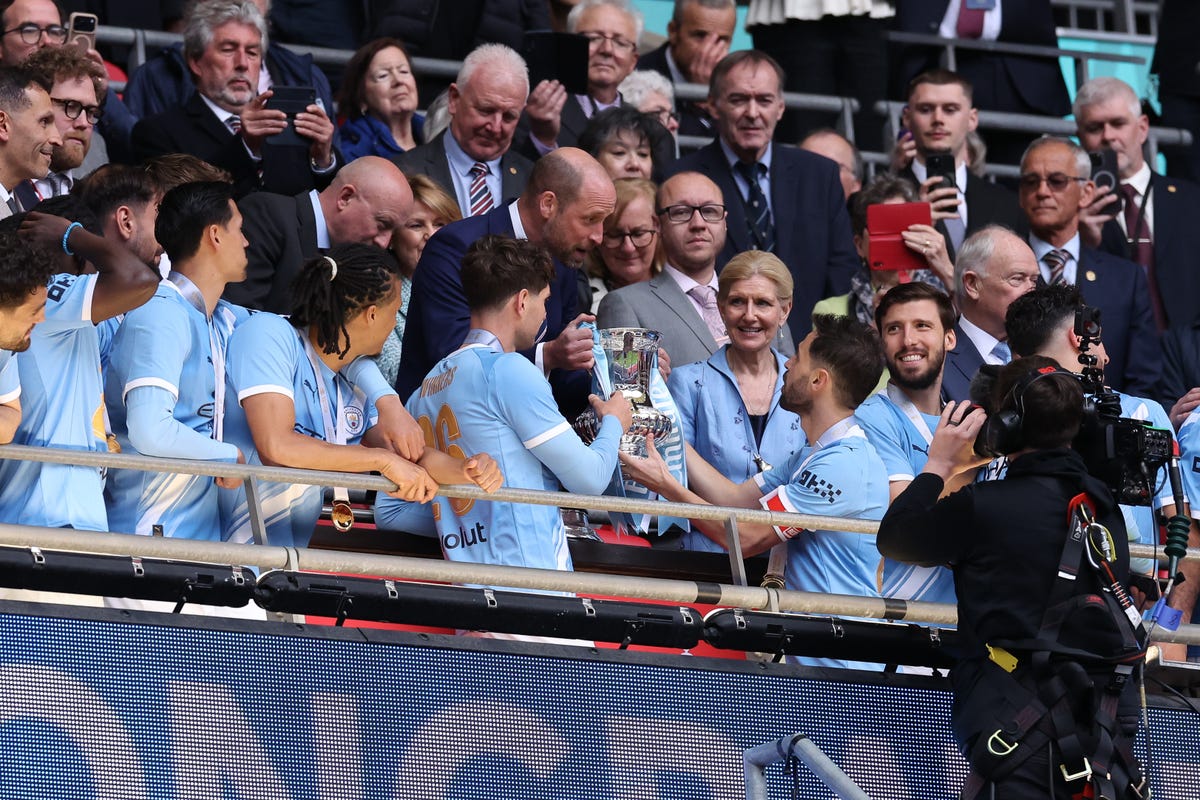 Prince William blends in with the FA Cup final crowd in a royal-blue suit
