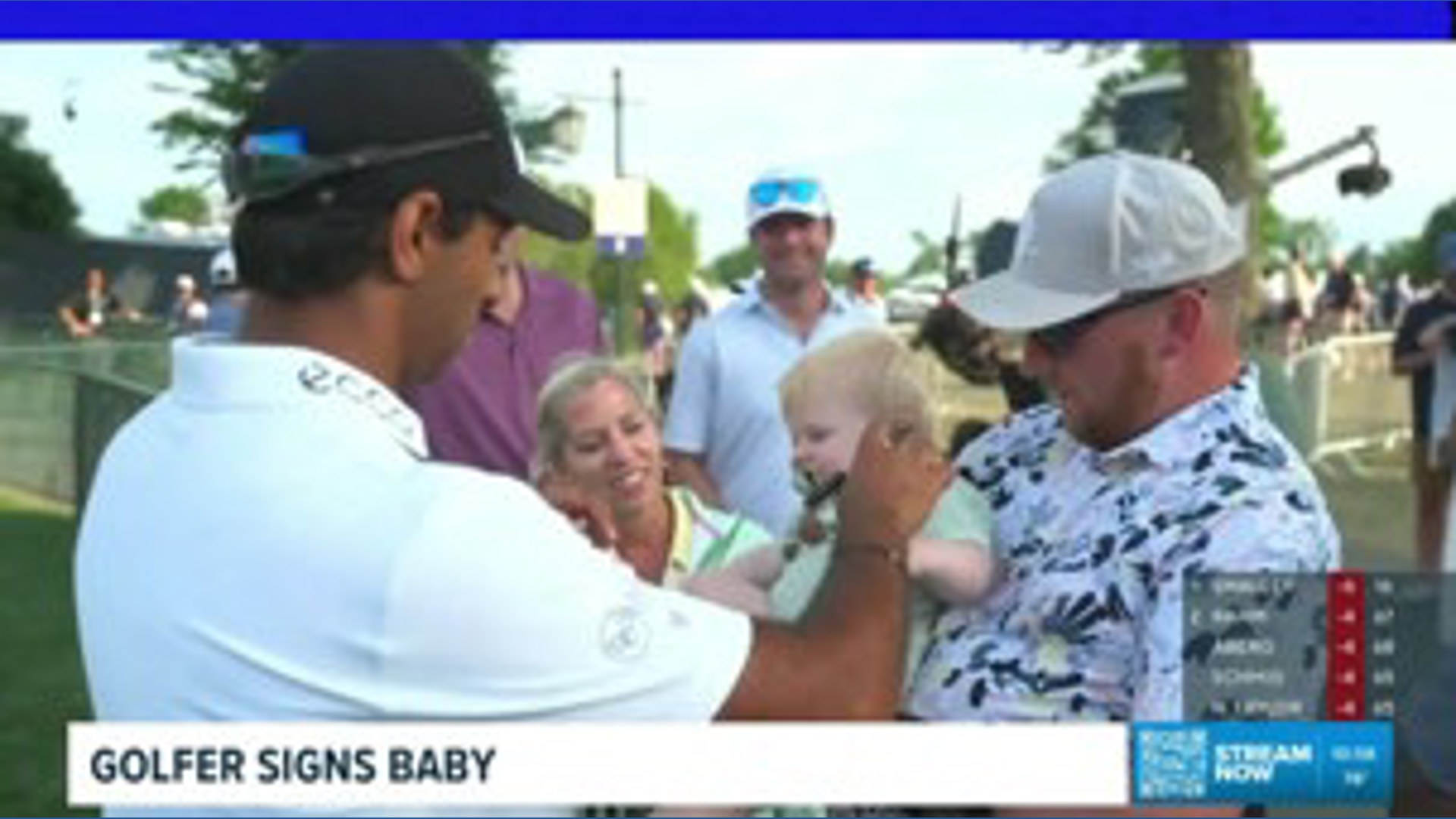 Golfer signs baby