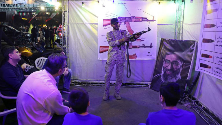 Guns on the television and in Iran’s streets as Trump renews war threats