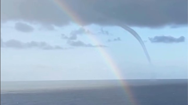 Cruise passenger films rare rainbow and waterspout side by side off the ...