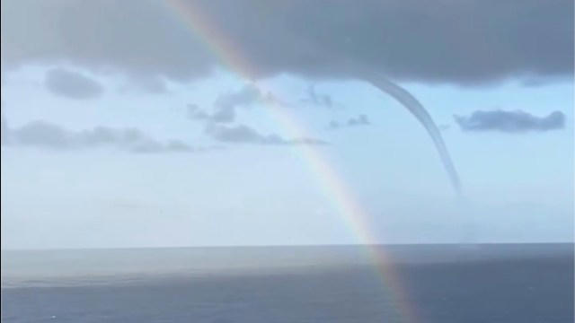 Cruise passenger films rare rainbow and waterspout side by side off the ...
