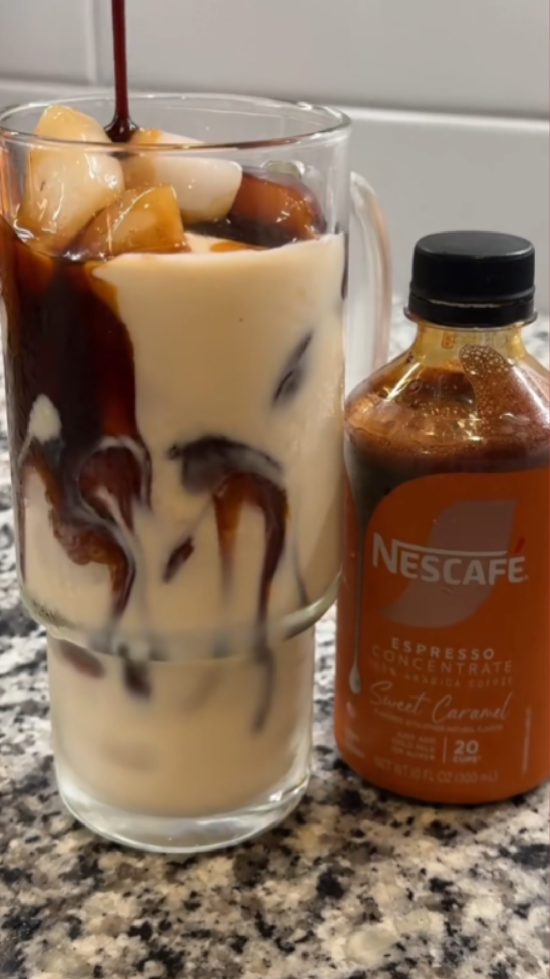 Iced caramel espresso coffee with cold foam