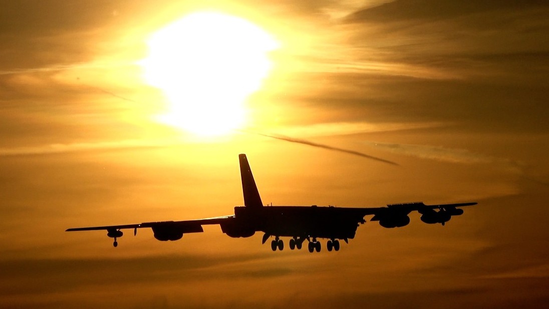 Watch a B-52 touch down at sunset – then the giant bomber goes around again