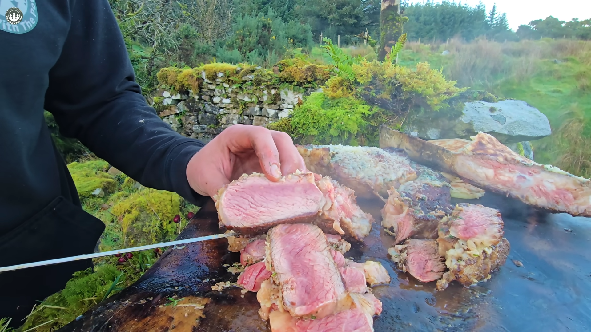Watch how this tomahawk steak sears on blazing hot stone